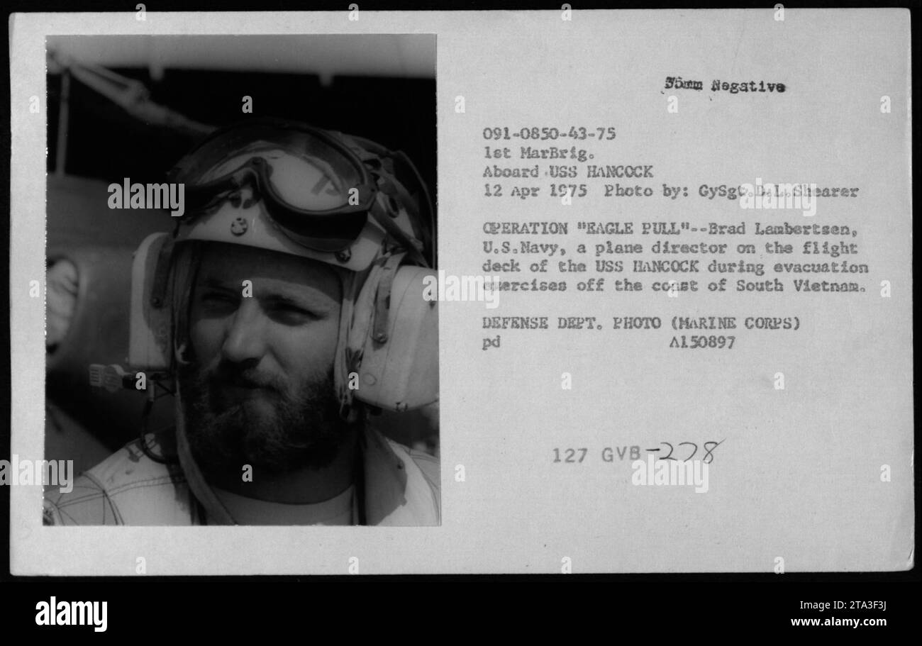 "US Navy plane director Brad Lambertsen directing evacuation exercises ...