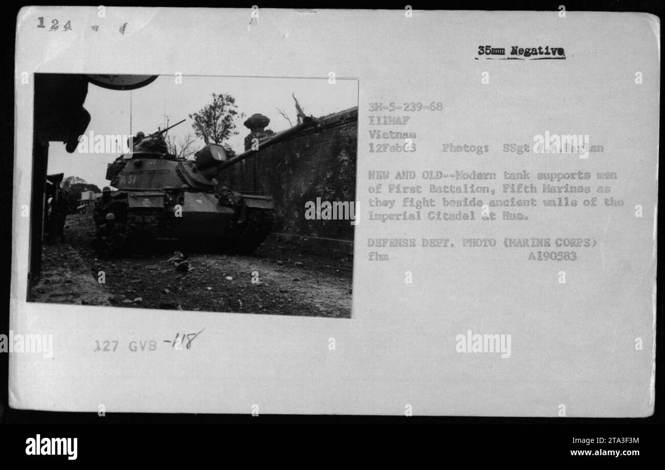 First Battalion, Fifth Marines are supported by a tank while engaging ...