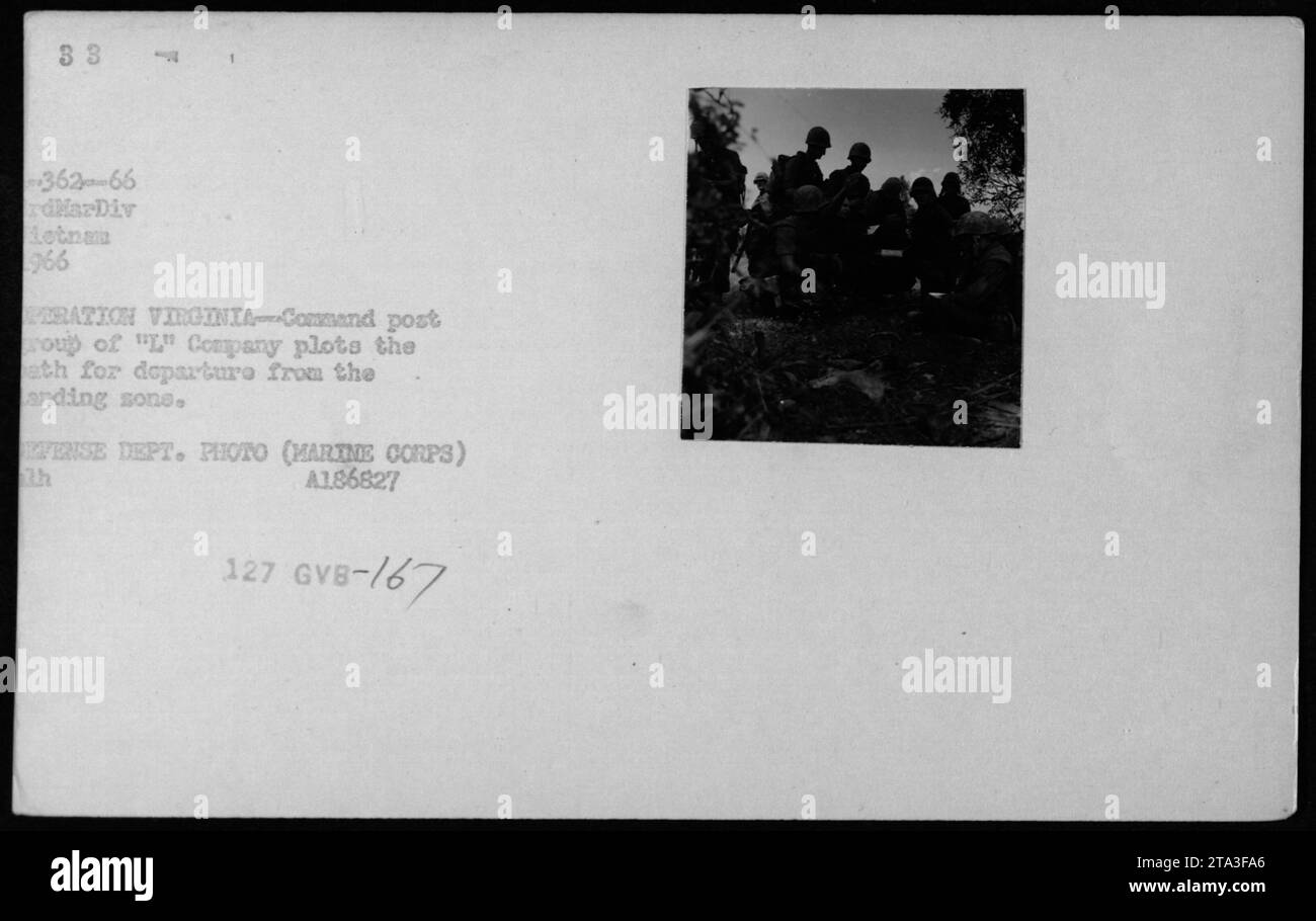 A group of soldiers from "L" Company are seen at their command post ...