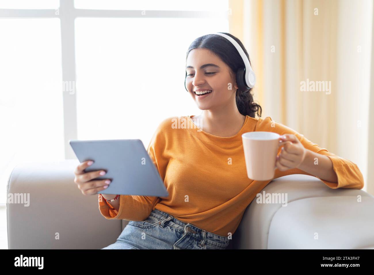 Home Pastime. Indian Woman Relaxing With Digital Tablet And Coffee On ...
