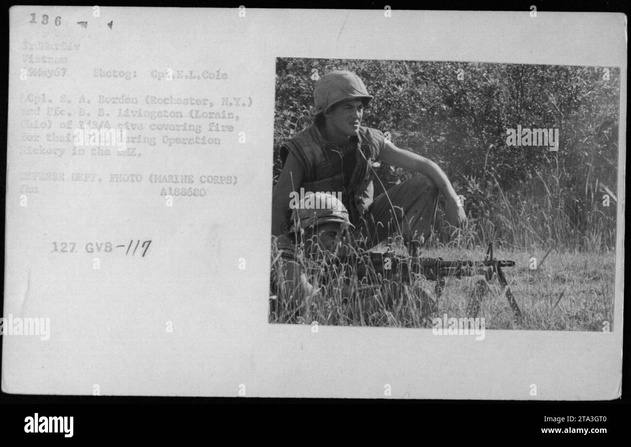 US Marine, Cpl. S. A. Bozden and Pfc. B. B. Livingston provide covering ...