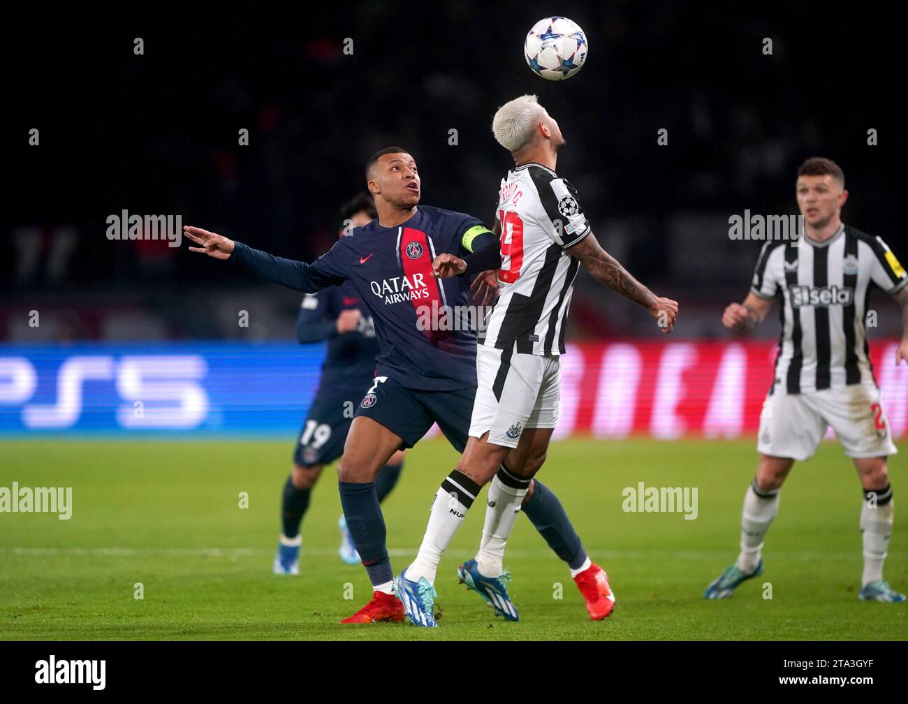 Paris Saint-Germain's Kylian Mbappe (left) and Newcastle United's Bruno ...