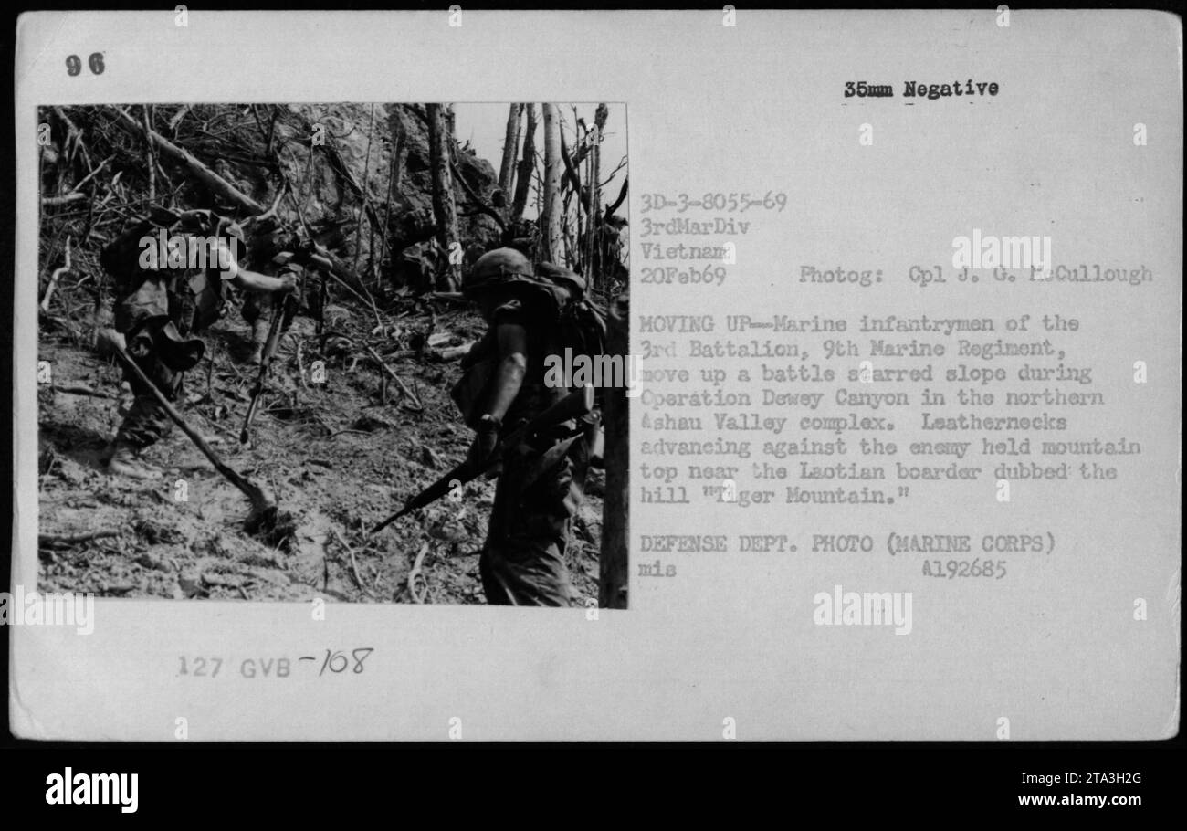 Marine infantrymen from the 3rd Battalion, 9th Marines ascend a damaged ...