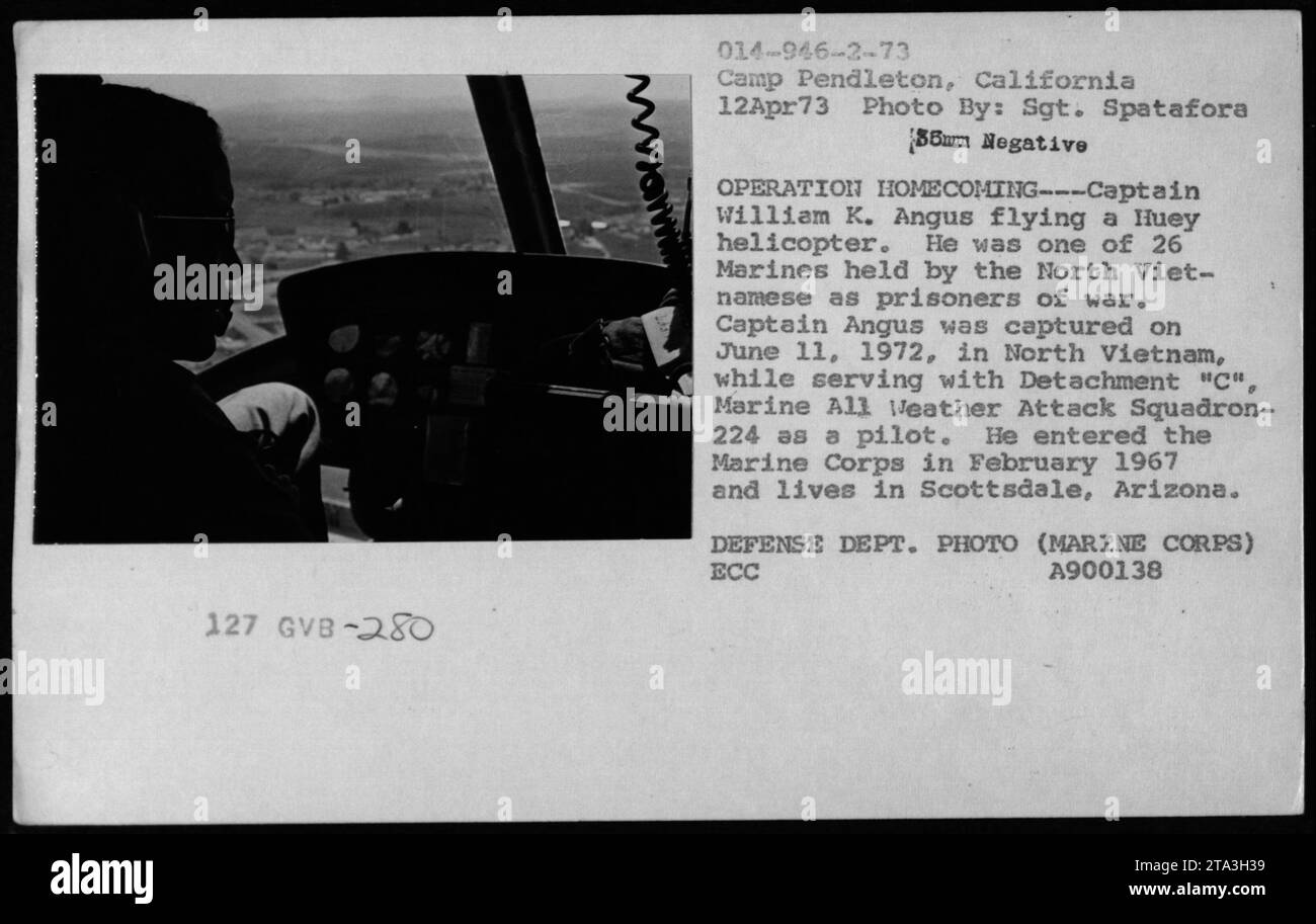 "Captain William K. Angus, a Marine POW, flies a Huey helicopter during ...