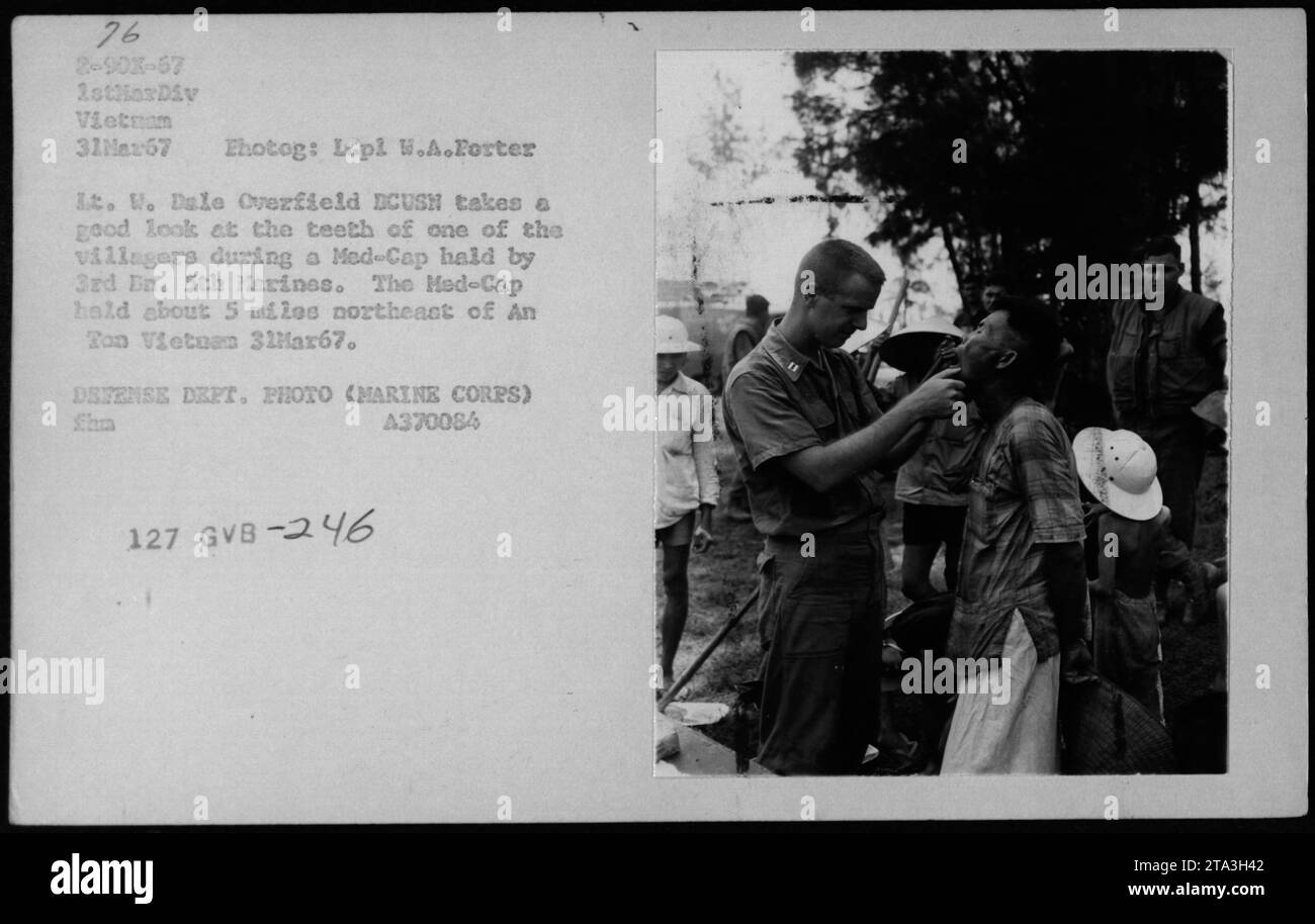 A medic with the 1st Marine Division, Lt. W. Dale Overfield, performs a ...