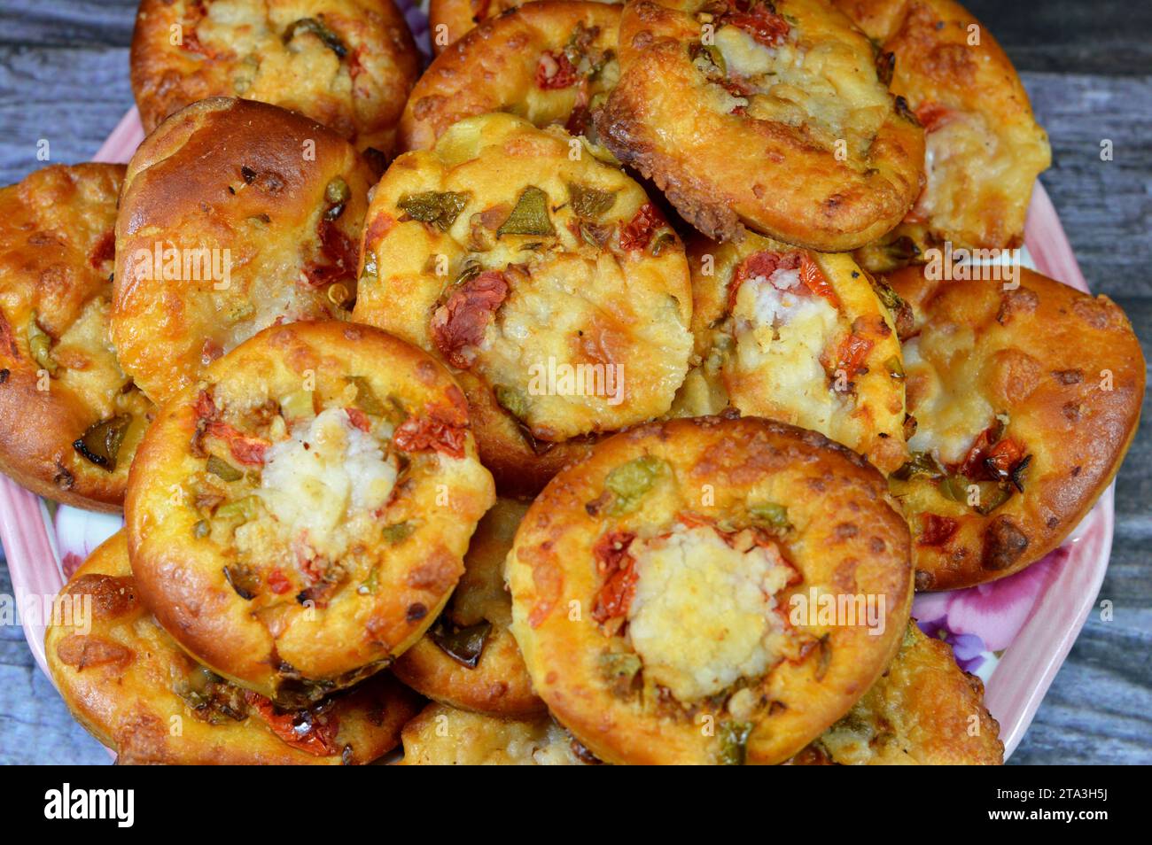Pile of mini pizzas, Pizza is a dish of Italian origin consisting of a ...