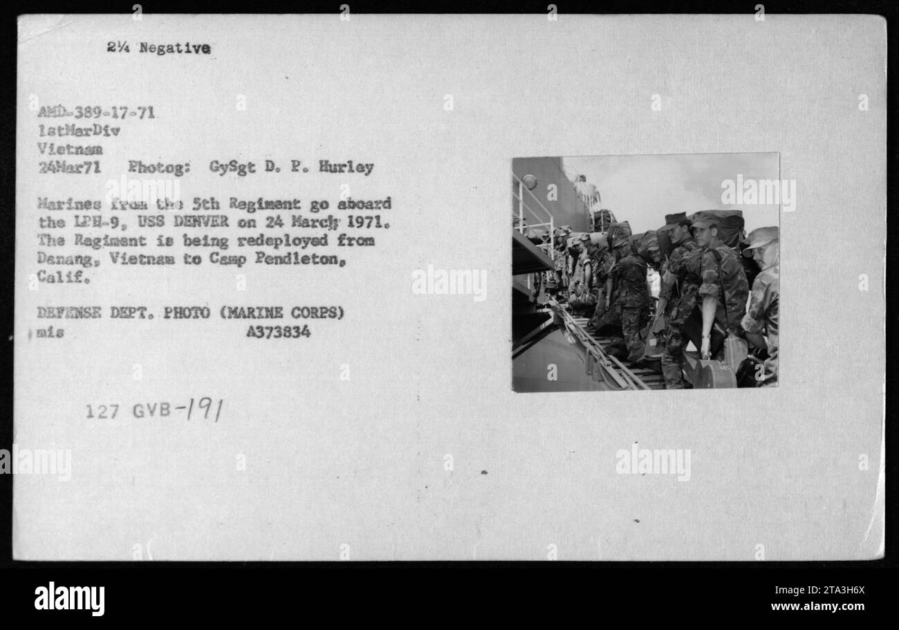 Marines from the 5th Regiment board the LPH-9 USS DENVER on March 24 ...