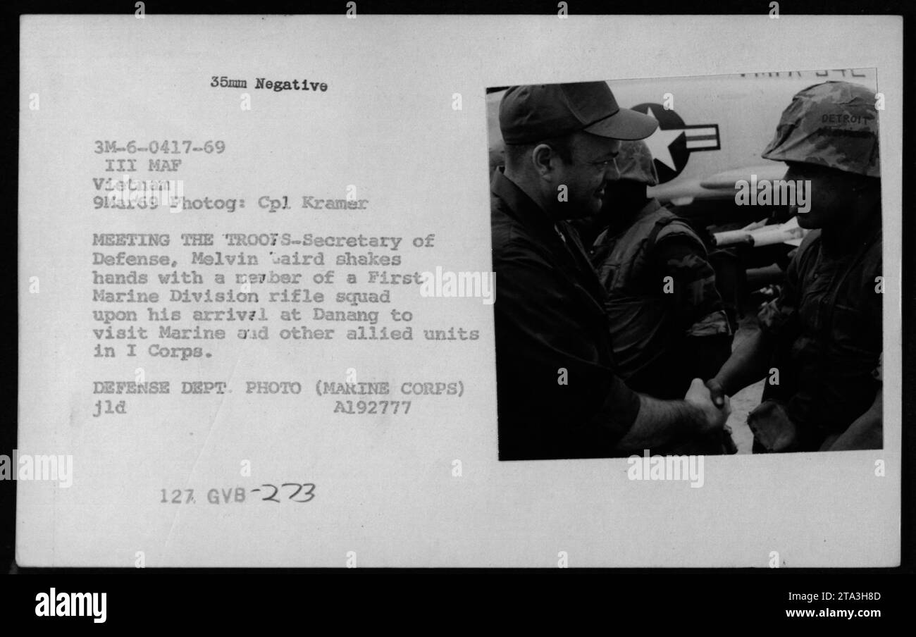 Secretary of Defense, Melvin Laird, shakes hands with a member of a ...