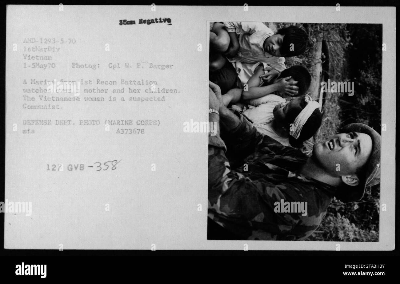 A Marine from 1st Recon Battalion observes a suspected Communist ...