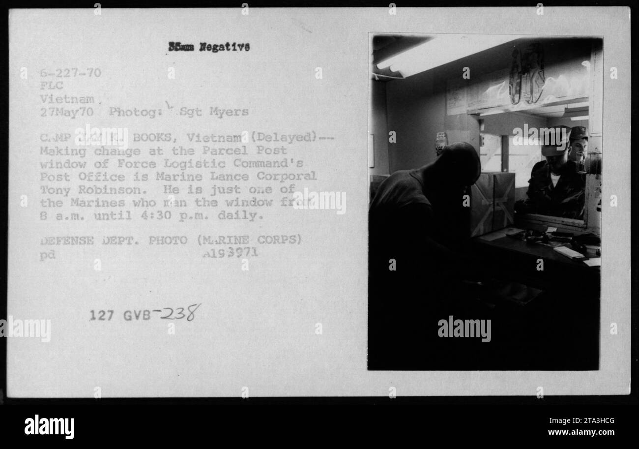 Marine Lance Corporal Tony Robinson is photographed performing duties ...