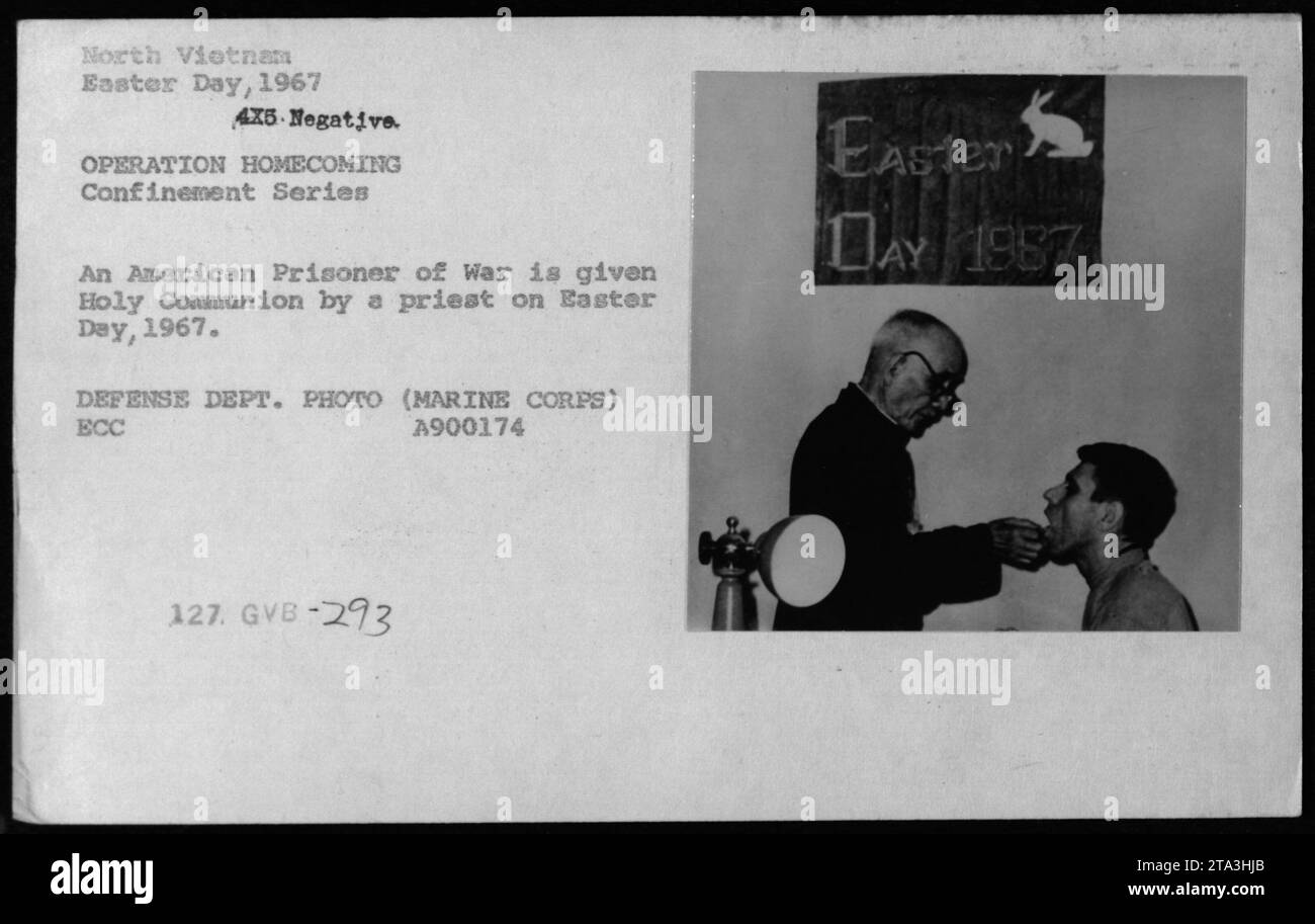 American Prisoner of War receiving Holy Communion from a priest on ...