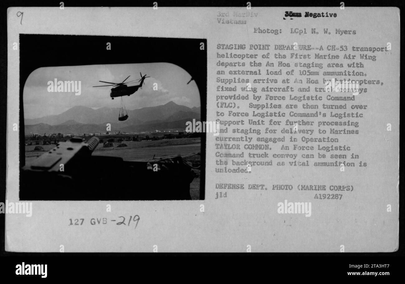 A CH-53 helicopter departs the An Hoa staging area carrying an external ...