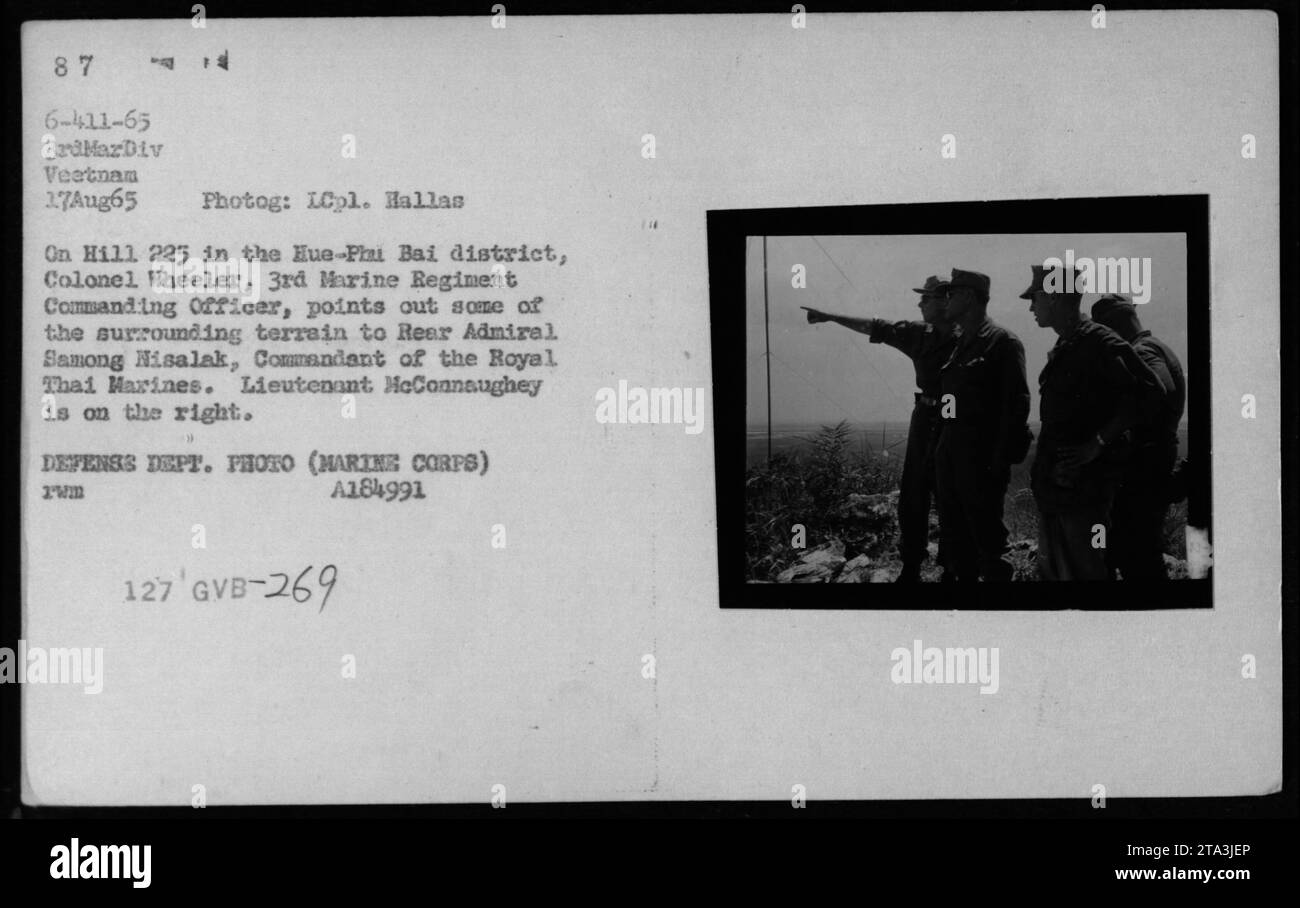 Colonel Wheeler, Commanding Officer of the 3rd Marine Regiment, points ...