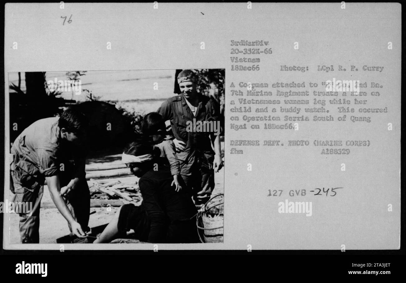 "Marine Corps Corpsman treats a sore on a Vietnamese woman's leg during ...