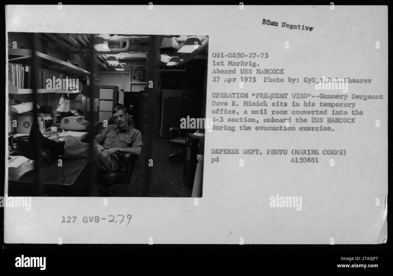 Gunnery Sergeant Dave R. Hinick works in a temporary S-3 office ...