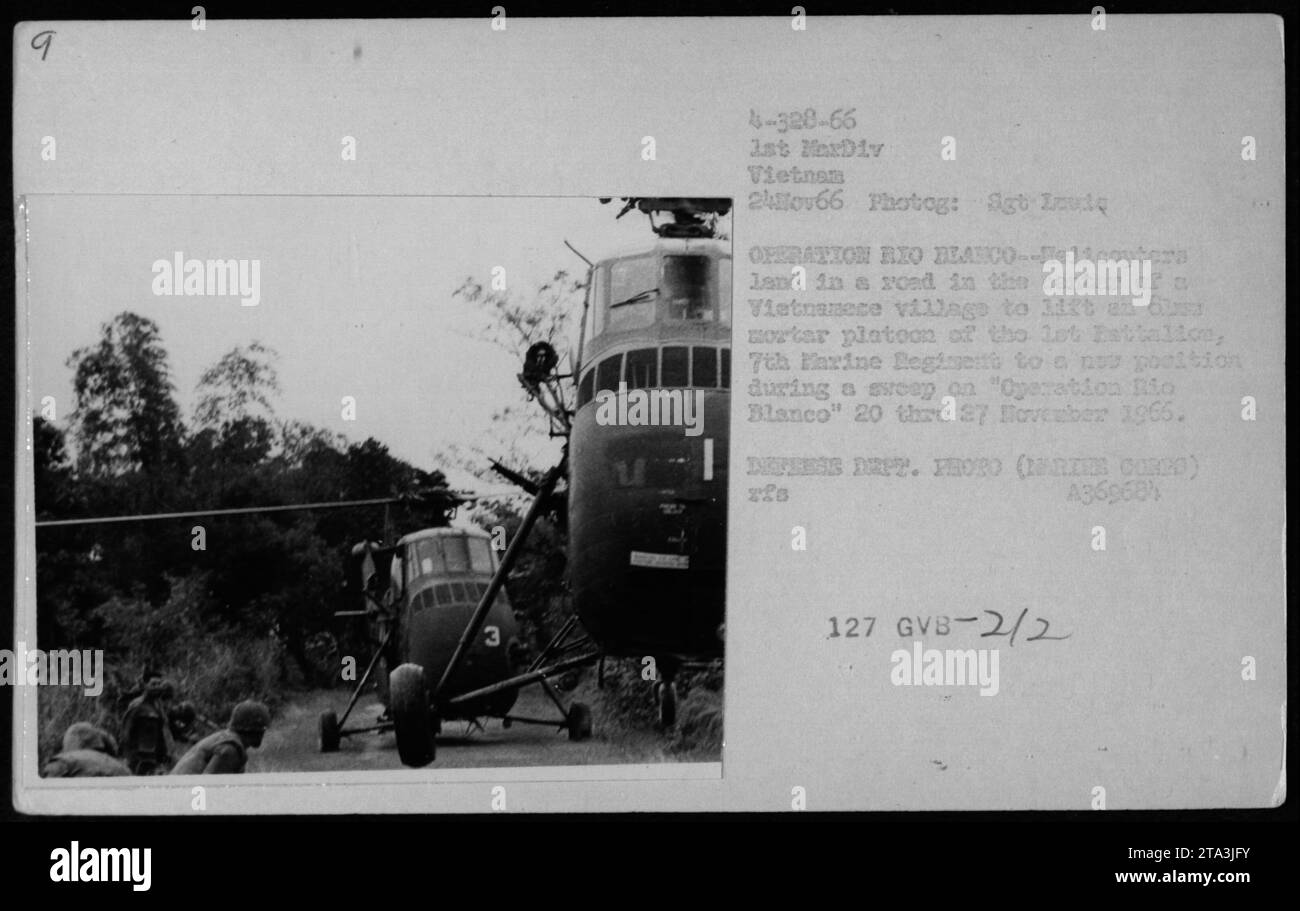 Helicopters land in a Vietnamese village on November 24, 1966, to ...
