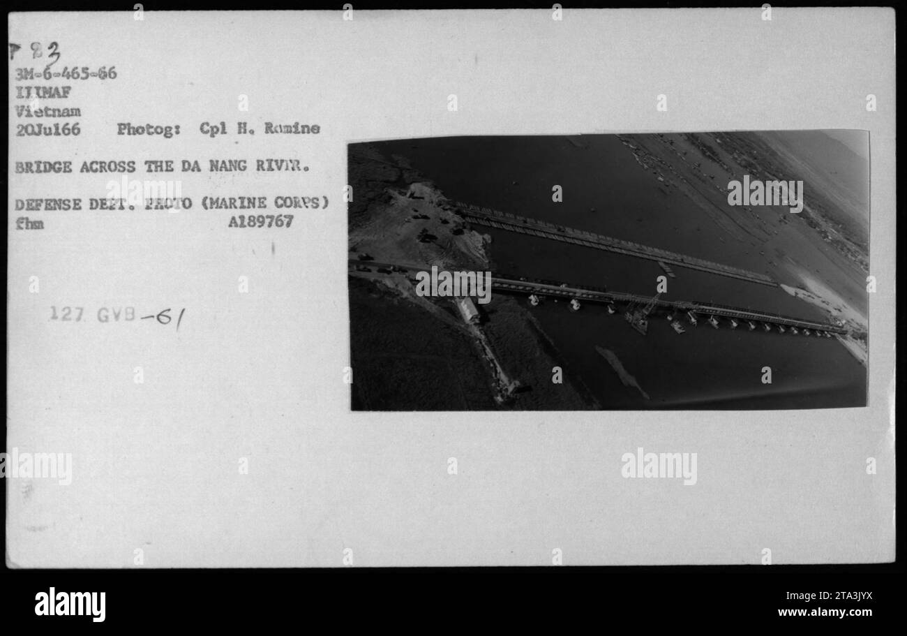 Soldiers of III Marine Amphibious Force cross a bridge over the Da Nang ...