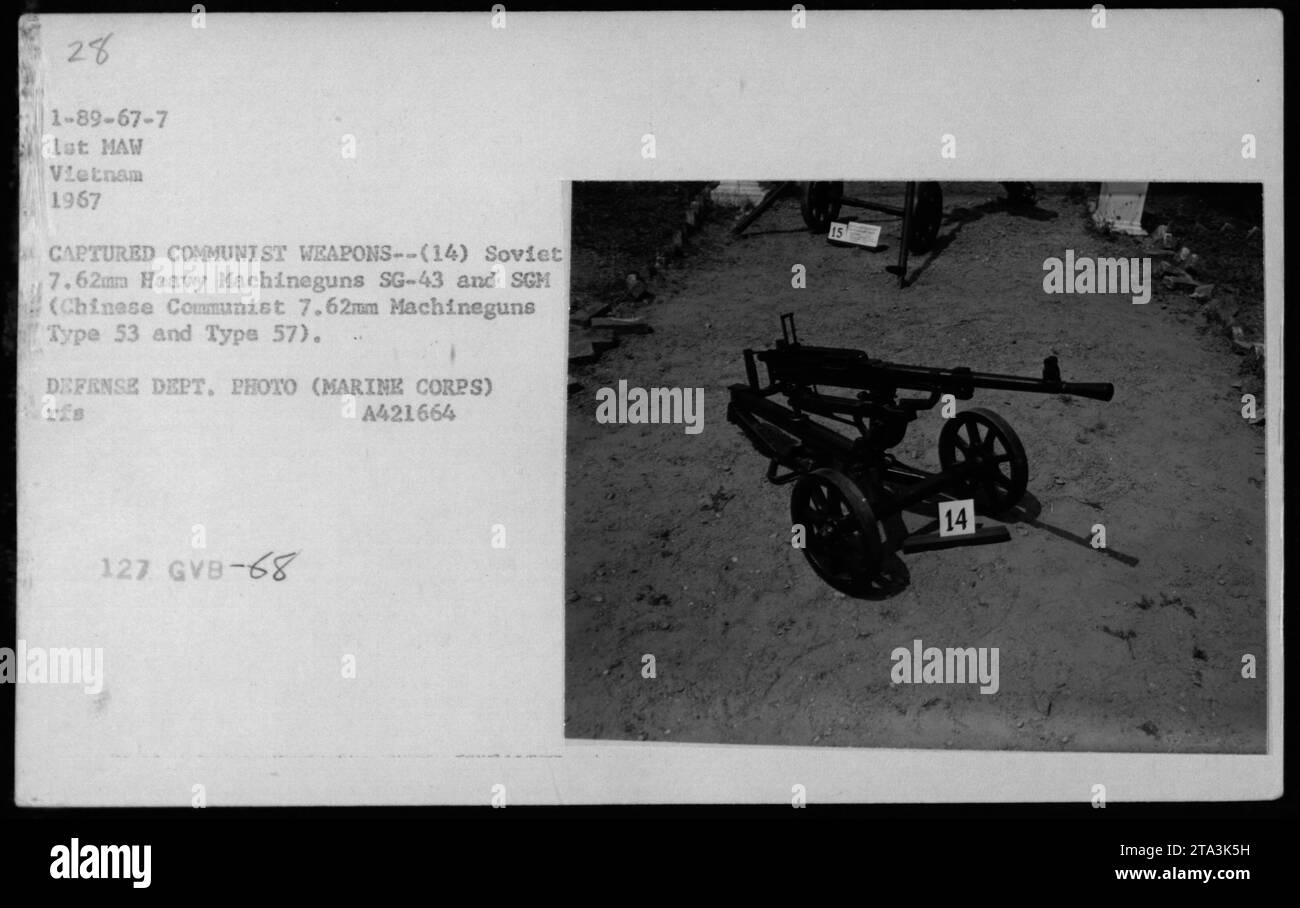 This photograph shows a collection of captured weapons during the ...