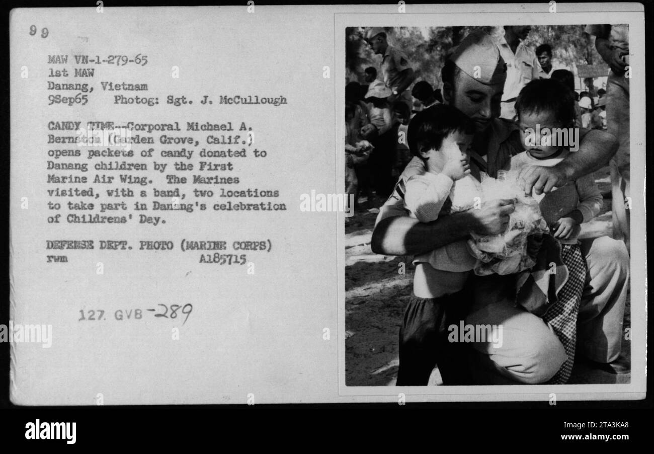 Corporal Michael A. Bernston, USMC, opens candy packets donated by the ...
