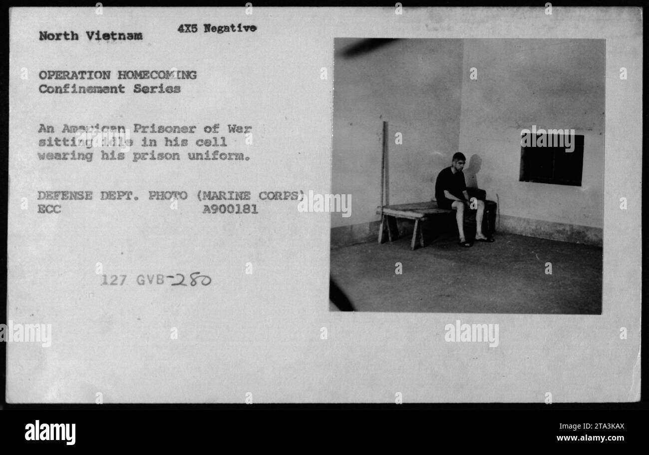 An American Prisoner of War sits idle in his cell, wearing his prison ...