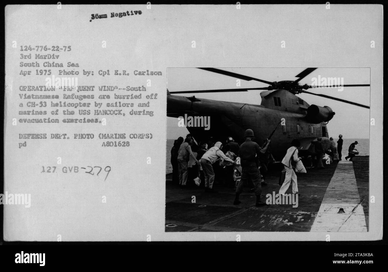 Sailors and Marines from USS Hancock offload South Vietnamese refugees ...