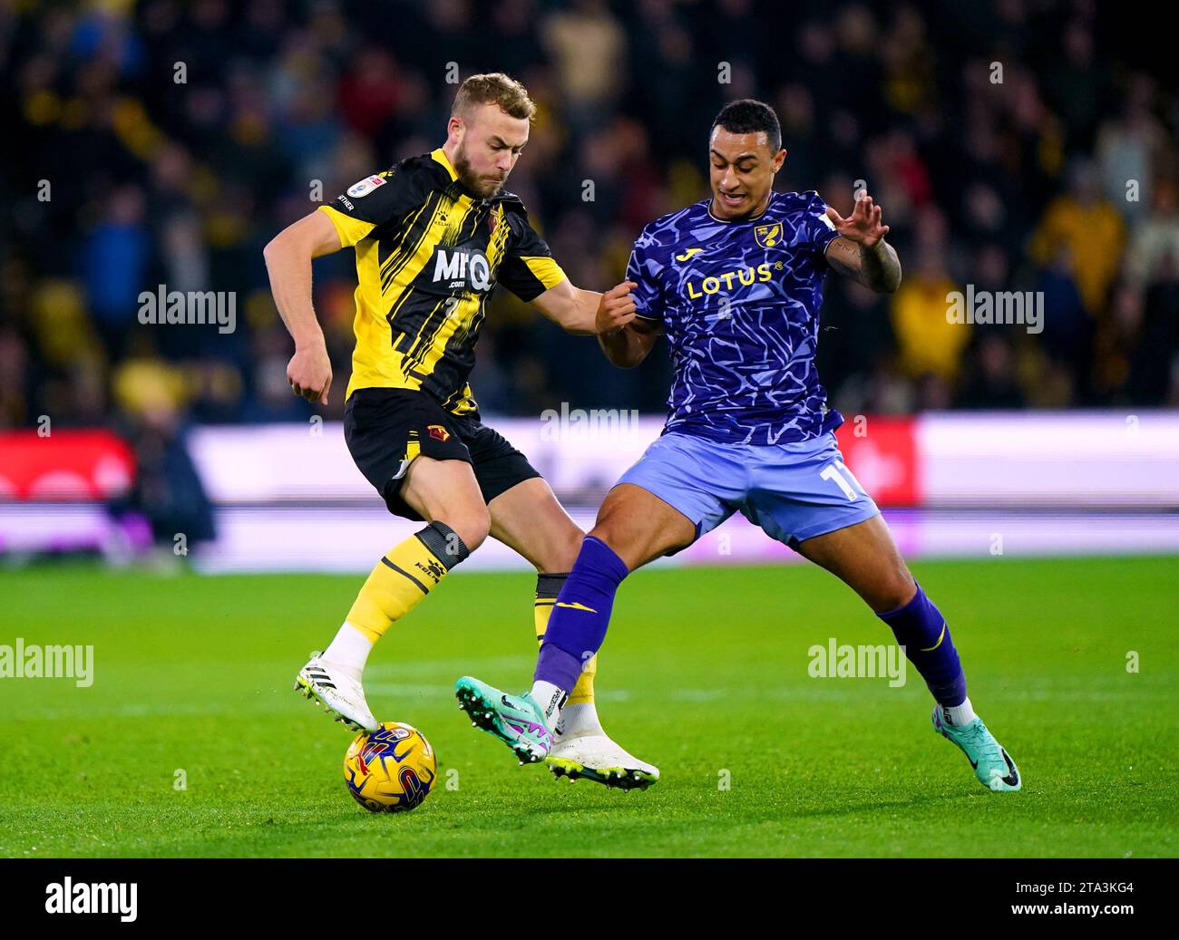 Norwich City's Adam Idah (right) and Watford's Ryan Porteous battle for ...