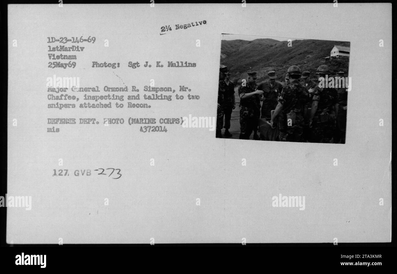 Major General Ormond R. Simpson and Mr. Chaffee inspect and converse ...