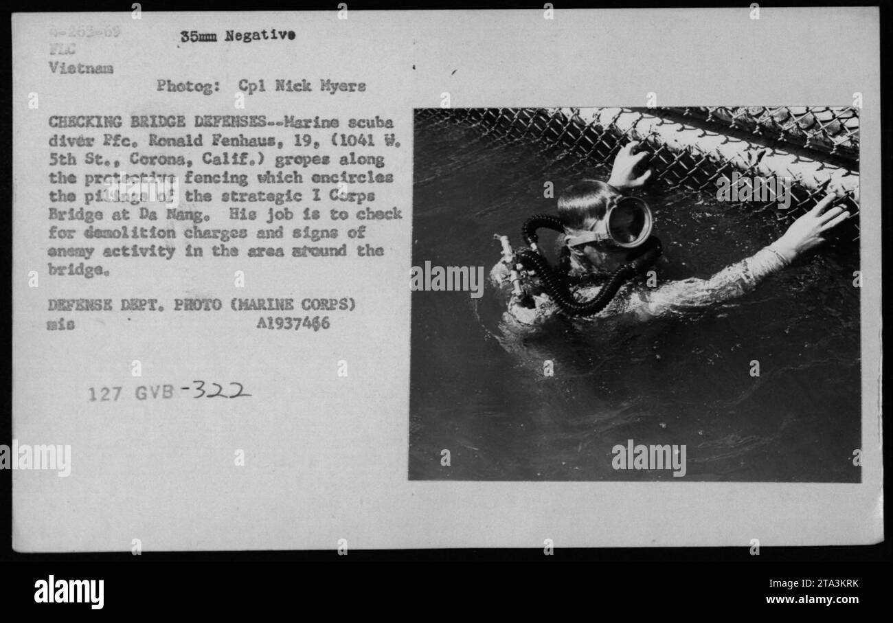 Marine scuba diver Pfc. Ronald Fenhaus is pictured checking bridge ...