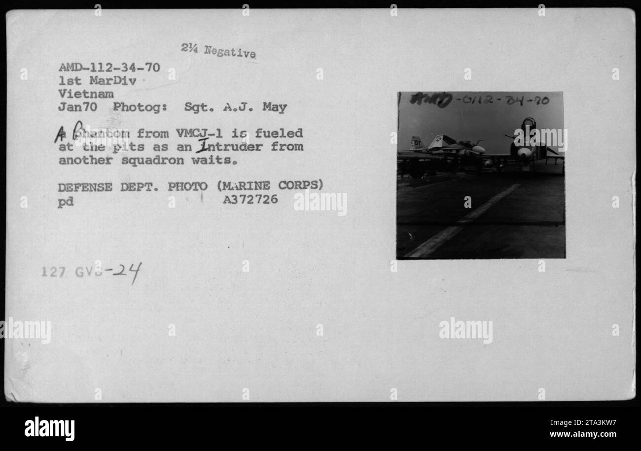 F-4 Phantom being refueled at the pits while another squadron's ...