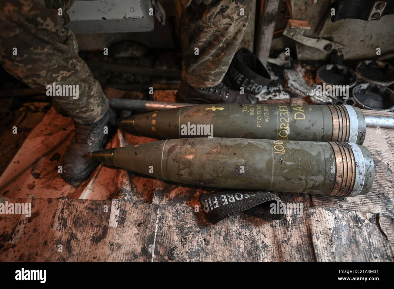 Ukraine. 28th Nov, 2023. Two 155mm artillery shells sit at the feet of ...