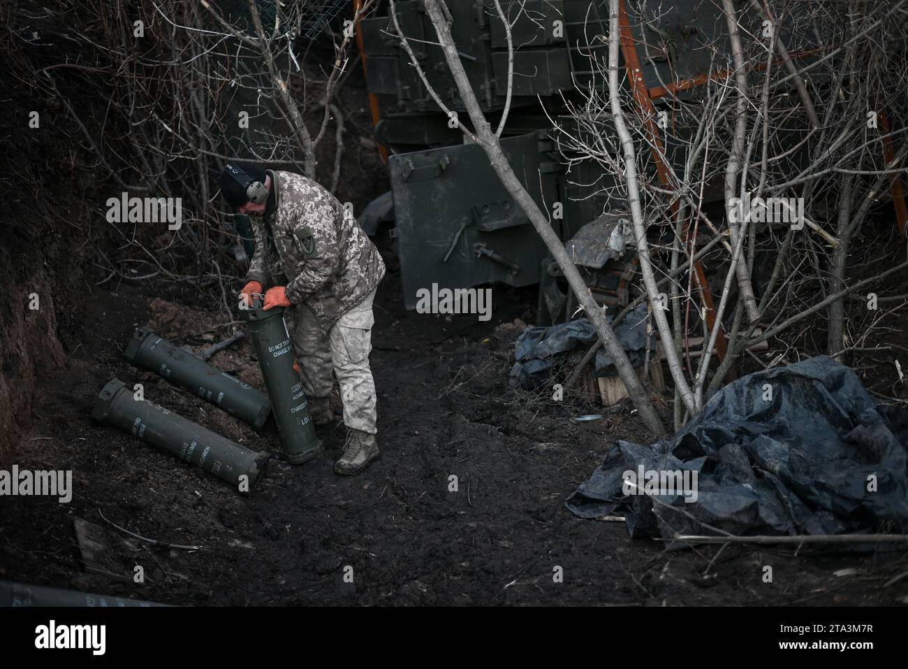 Ukraine. 28th Nov, 2023. A Ukrainian servicemember unpacks artillery ...