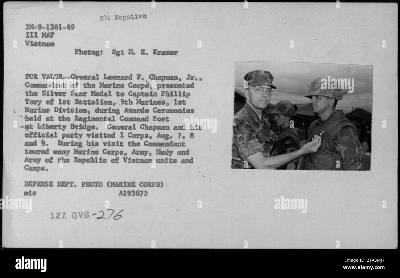 "General Leonard F. Chapman, Jr., Commandant of the Marine Corps, presents the Silver Star medal ...