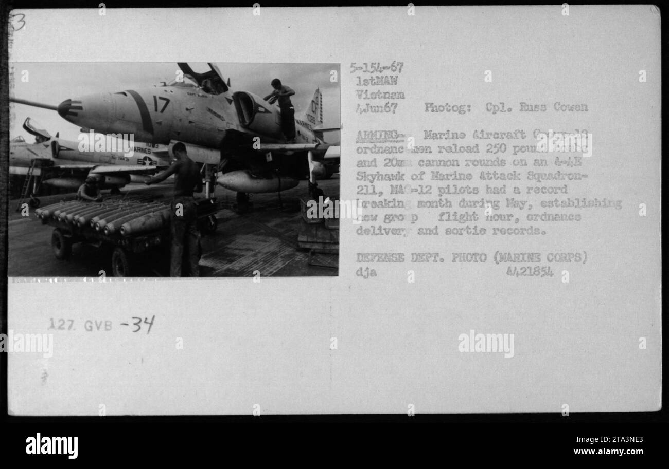 Marine Aircraft Group-12 ordnance men reloading 250-pound bombs and ...