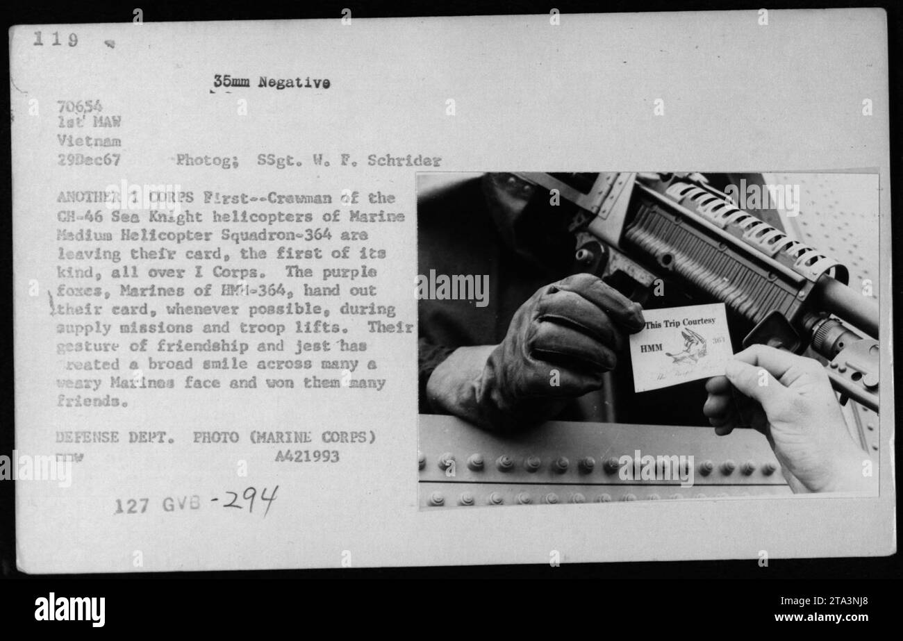 Marines from HMM-364, known as the Purple Foxes, distribute their card ...