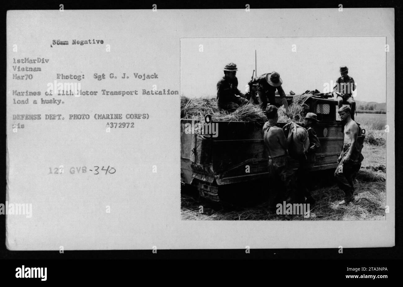 Marines from the 11th Motor Transport Battalion load a Husky armored ...