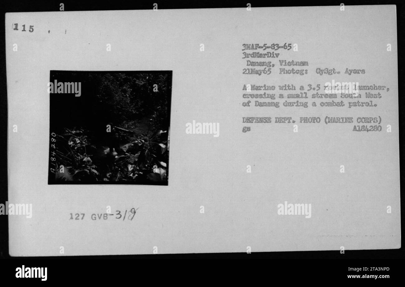 Marine Corps soldier Ayors A. Marino crosses a stream in southwest ...