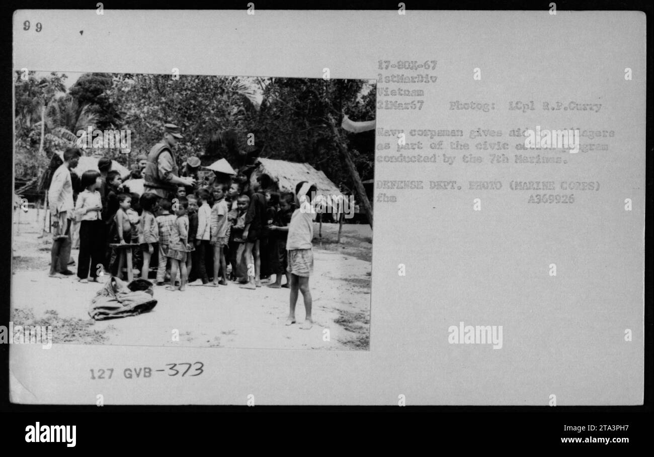 A US Navy corpsman provides medical assistance to Vietnamese villagers ...