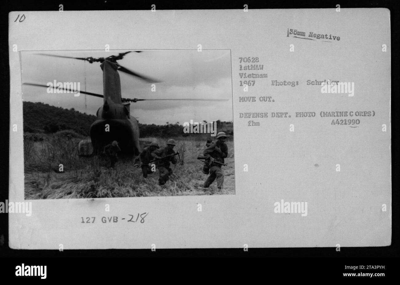 A CH-46 helicopter hovers above a military compound during the Vietnam ...
