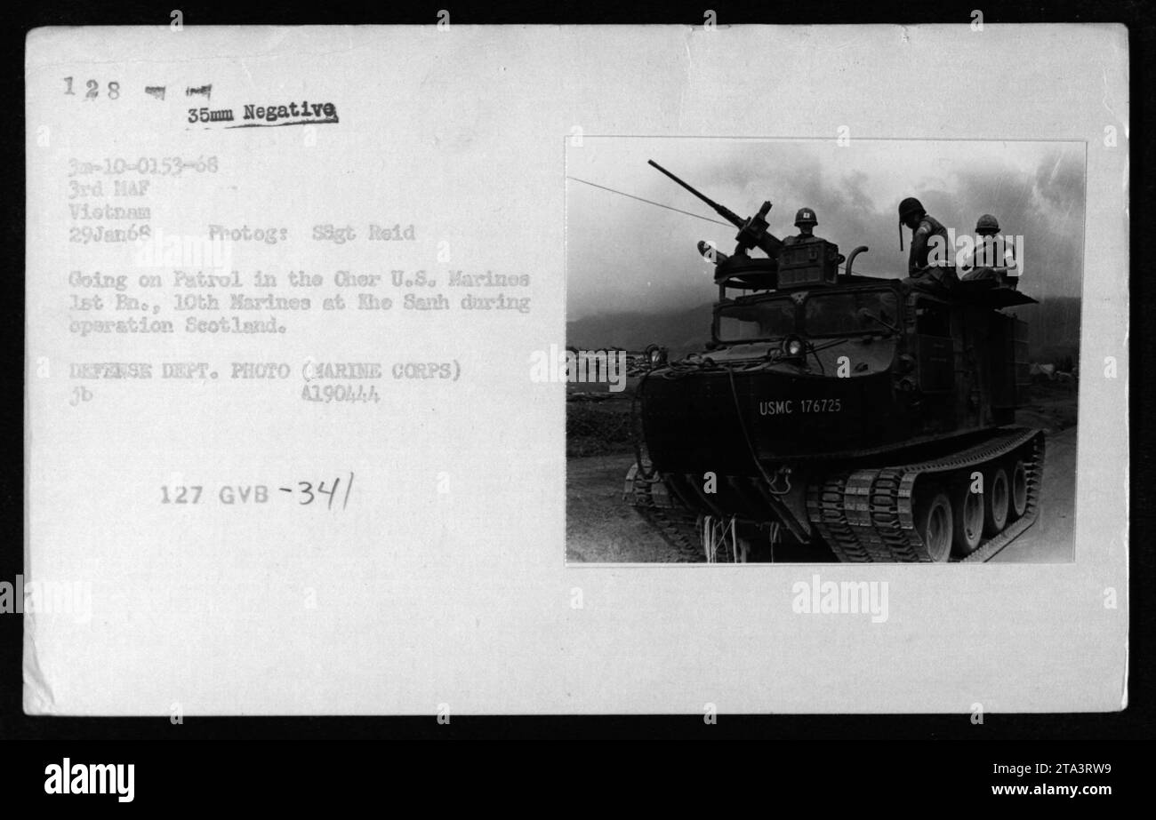 U.S. Marine Corps members from the 1st En., 10th Marines are seen going ...