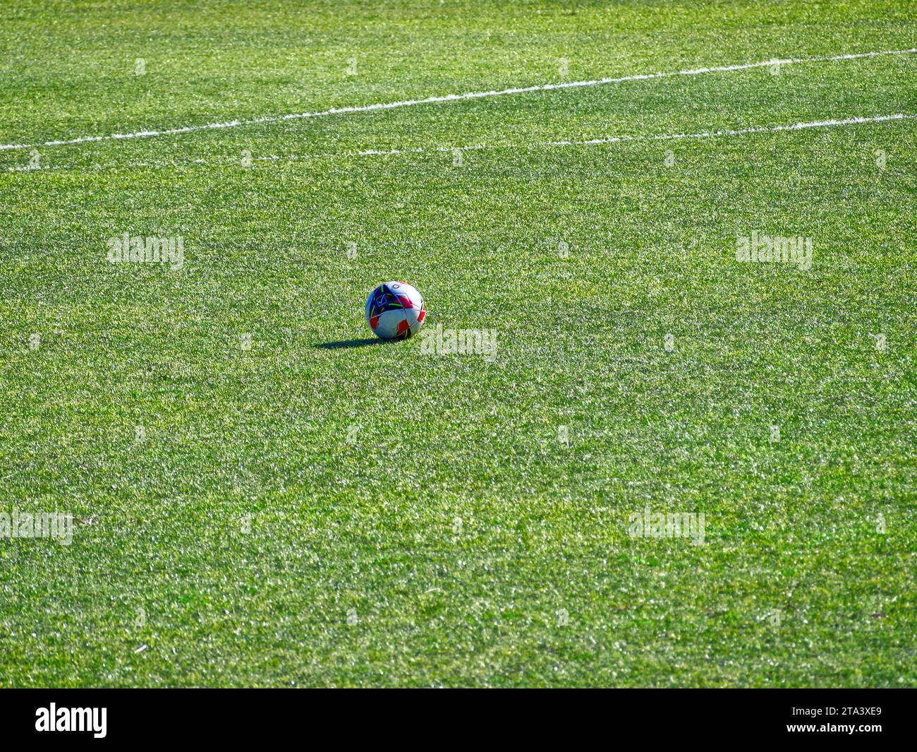 Football field background with ball in view Stock Photo - Alamy