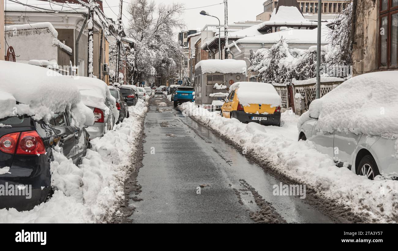 Cars covered in snow, first day of winter in Bucharest City, Romania ...