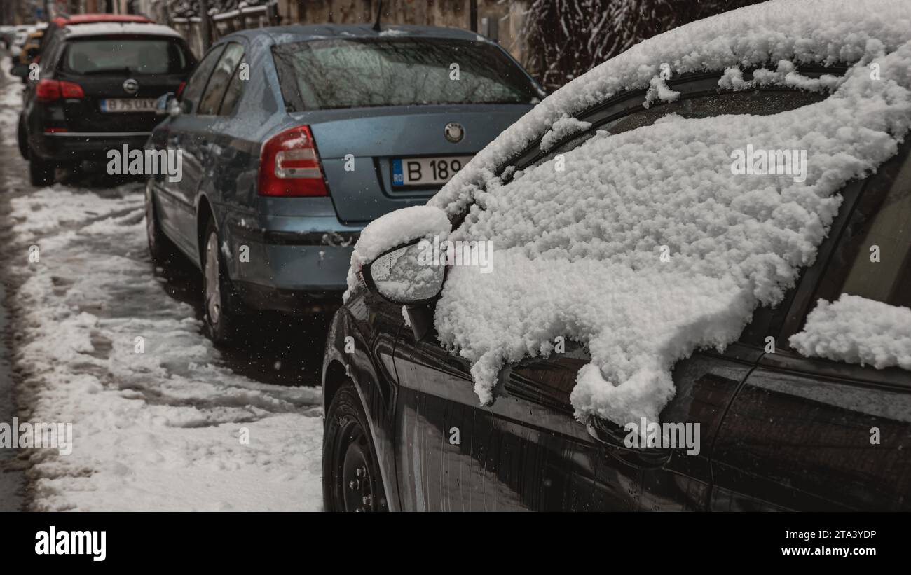 Cars covered in snow, first day of winter in Bucharest City, Romania ...