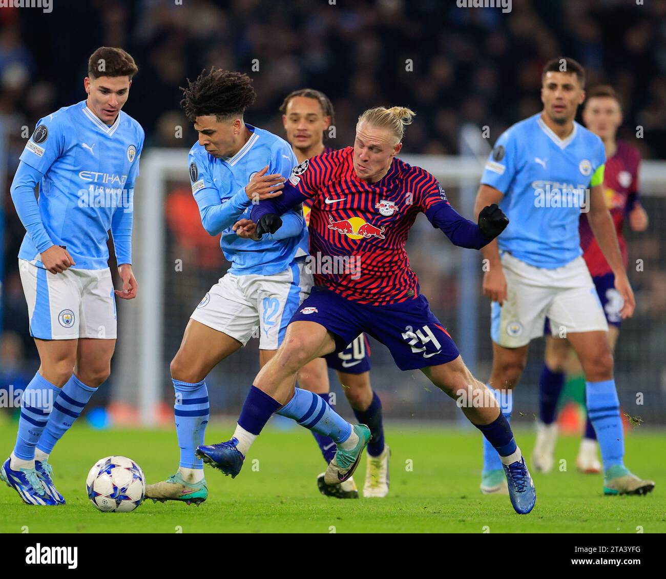 Rico Lewis #82 of Manchester City and Xaver Schlager #24 of RB Leipzig battle for the ball ...