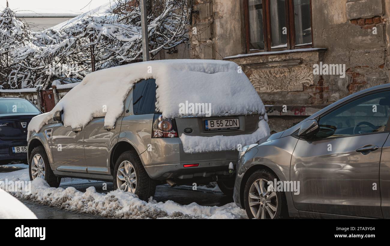 Cars covered in snow, first day of winter in Bucharest City, Romania ...