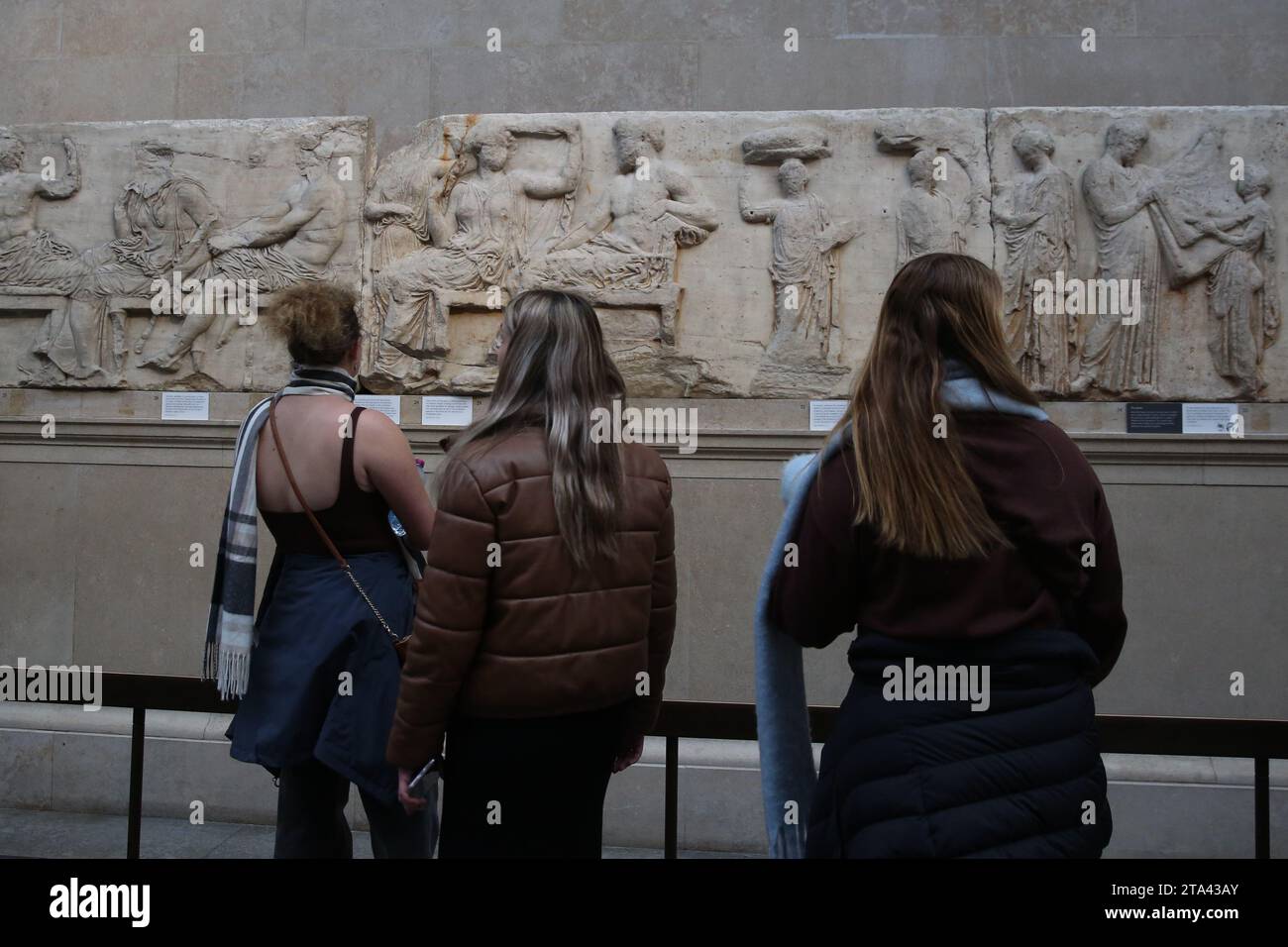 Visitors view Elgin marbles also known as the Parthenon marbles, at the British Museum, London ...