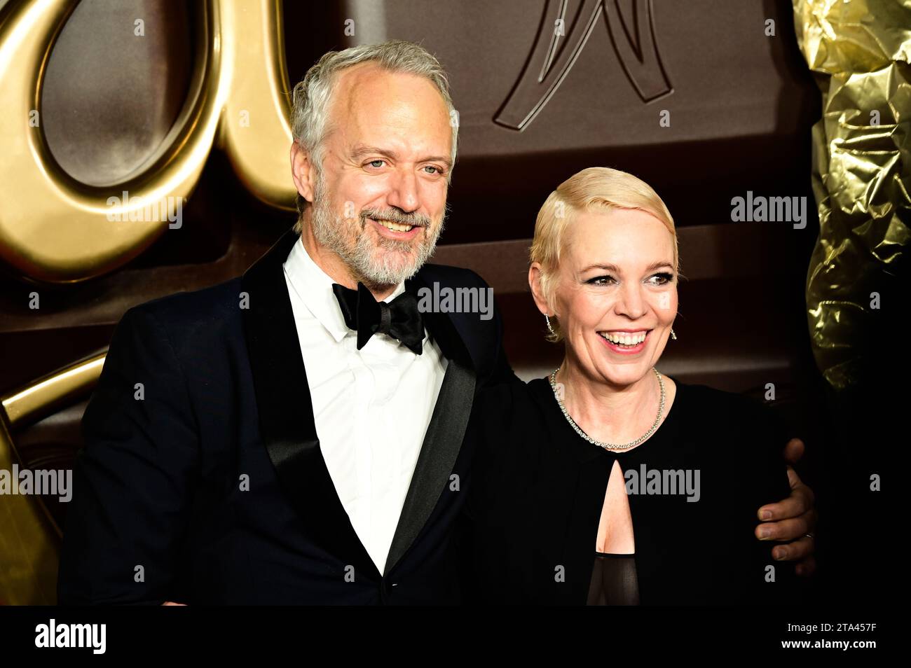 London, UK. 28th Nov, 2023. Ed Sinclair and Olivia Colman attends the ...