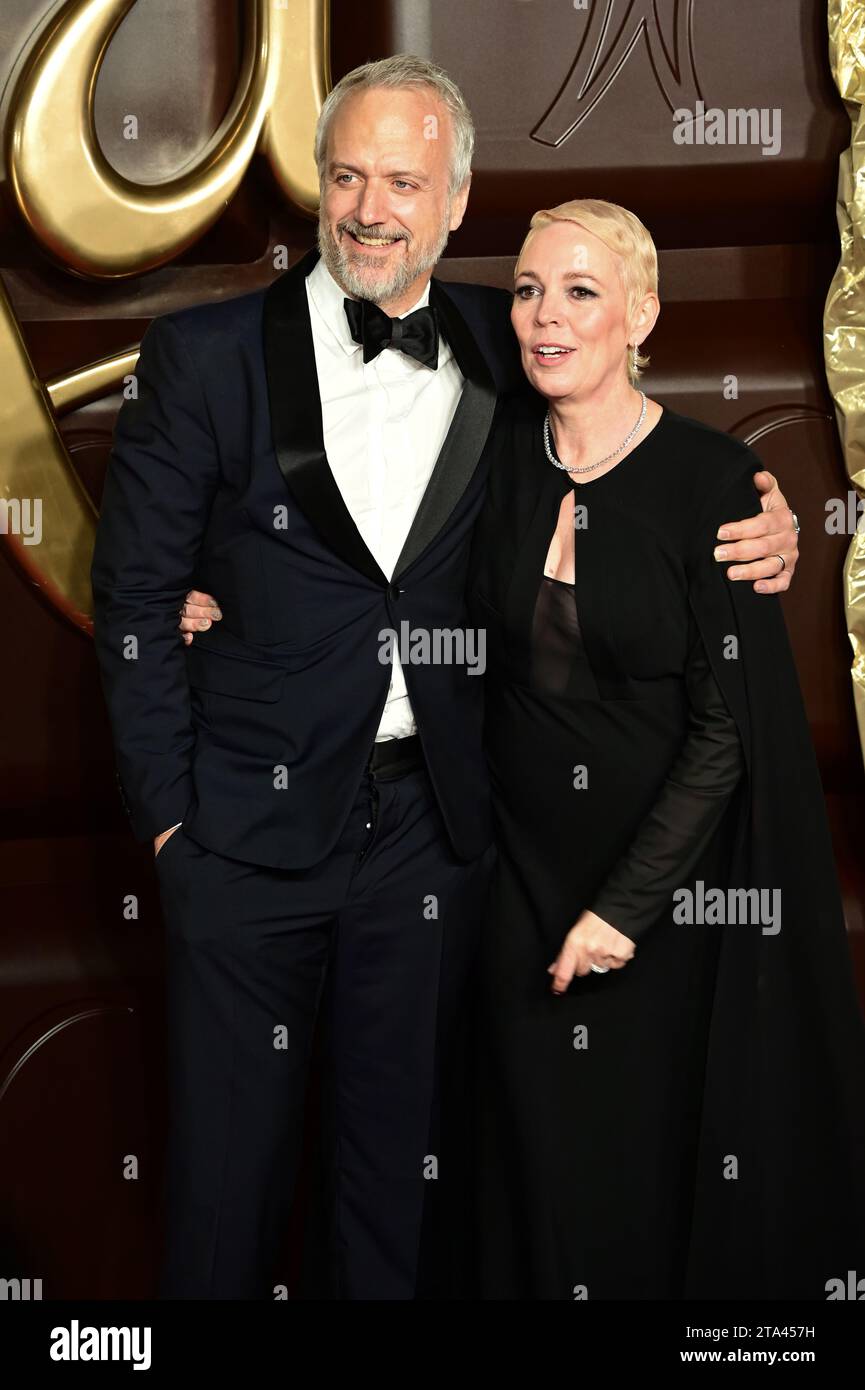 London, UK. 28th Nov, 2023. Ed Sinclair and Olivia Colman attends the ...