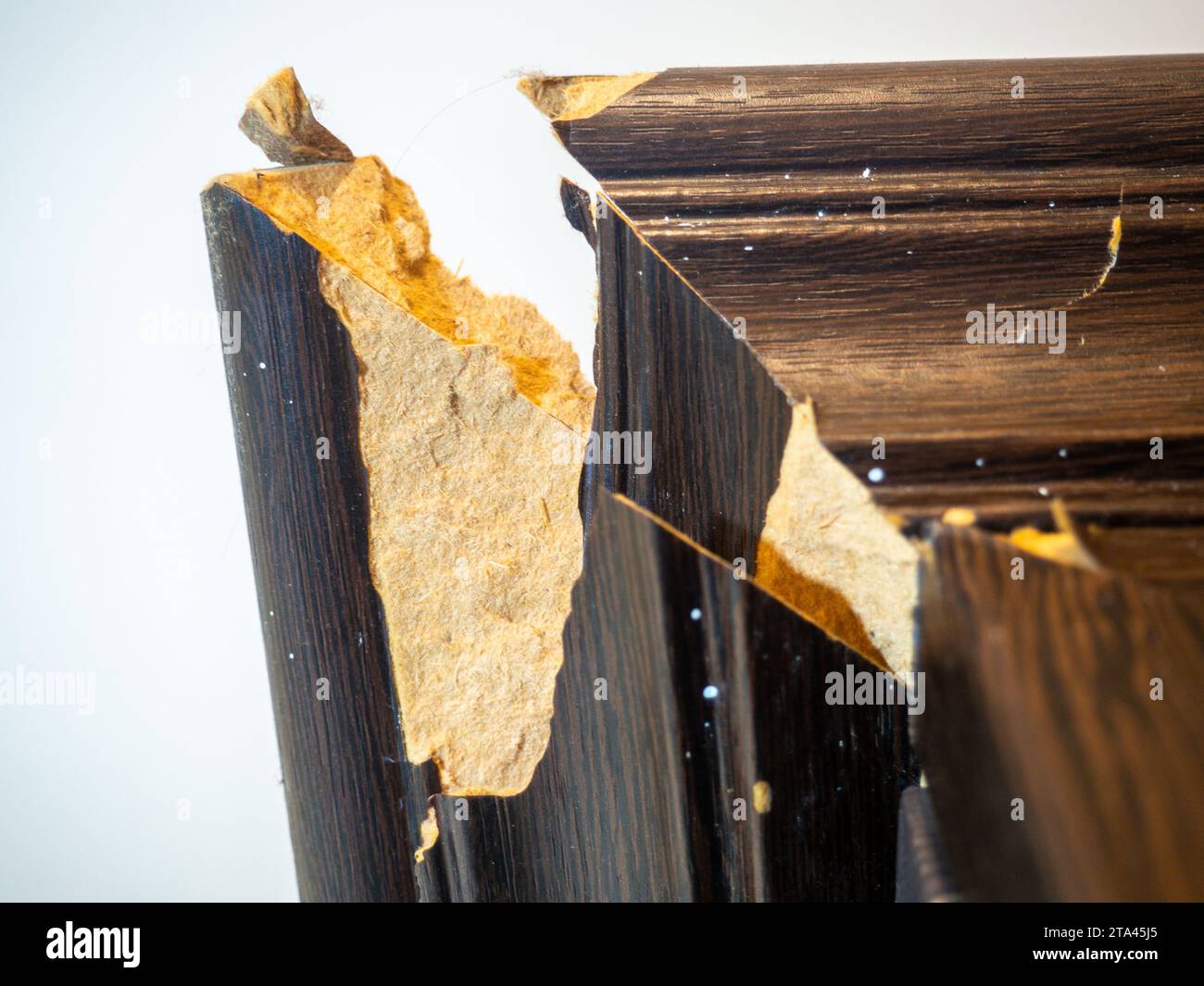 corner of the cabinet is broken. Crack in a wooden cabinet. Breakage ...
