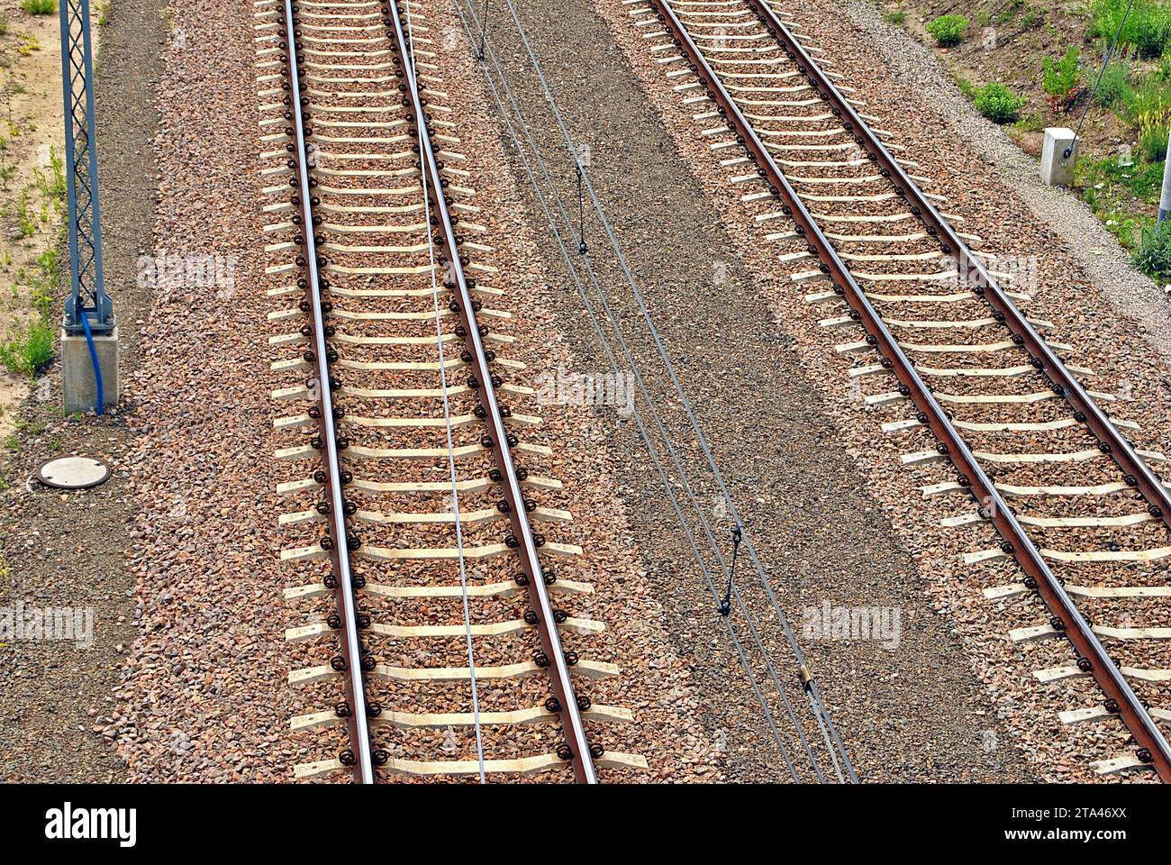 Railroad tracks at a train station Stock Photo - Alamy