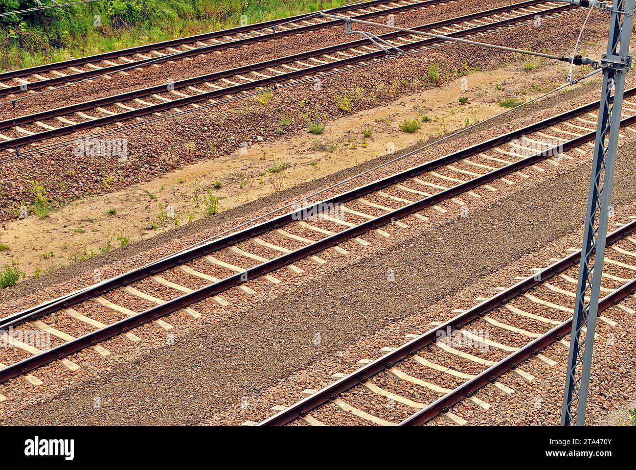 Railroad tracks at a train station Stock Photo - Alamy